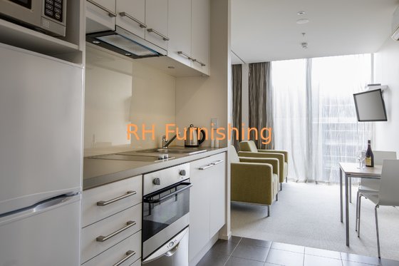 Fashion hotel style apartment usd laminate kitchen cabinets with Upholstered bed and Sofa chairs supplier