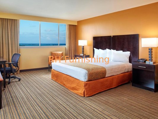 Jogja hotel interior design of guestroom furniture wood panel headboard and Drawer of TV cabinet with leisure chair supplier