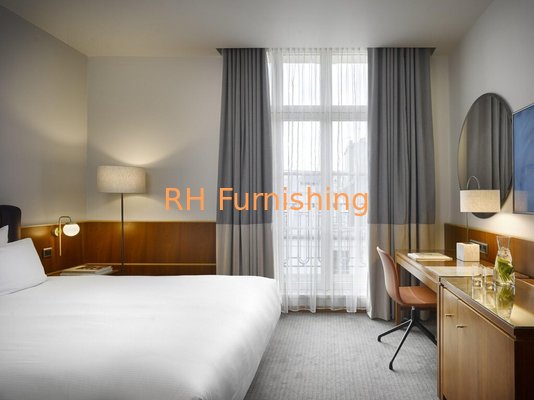 Madagascar hotel bedroom furniture set of wood headboard bed with combine desk table and fabric cushion chairs supplier