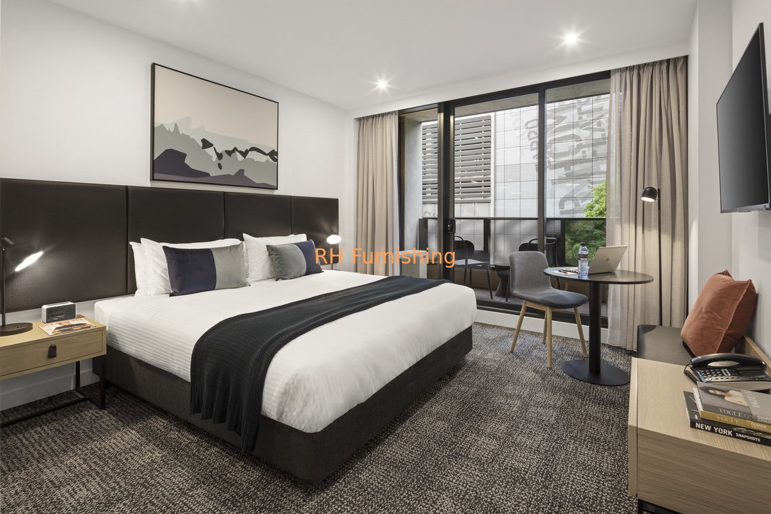 Budget hotel bedroom furniture of PU leather upholstery bed and Laminate desk with TV cabinets supplier
