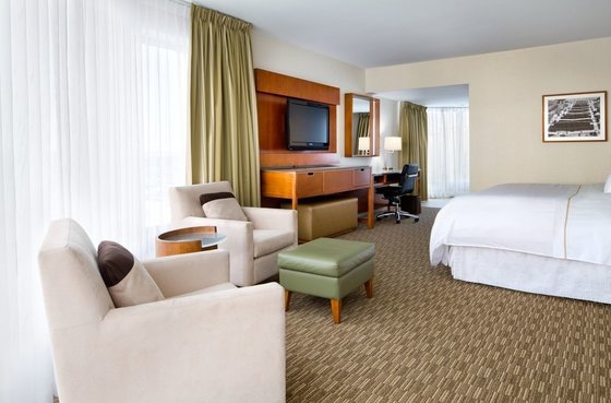 Contemporary Mahogany Panel Full Size Bed Hotel Furniture Set With Leather Chairs supplier