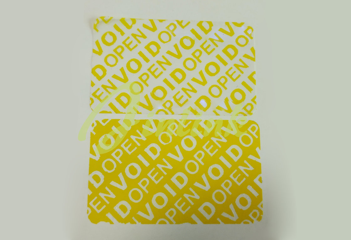 Yellow total transfer warranty security void open label material , Full residue tamper evident void label material