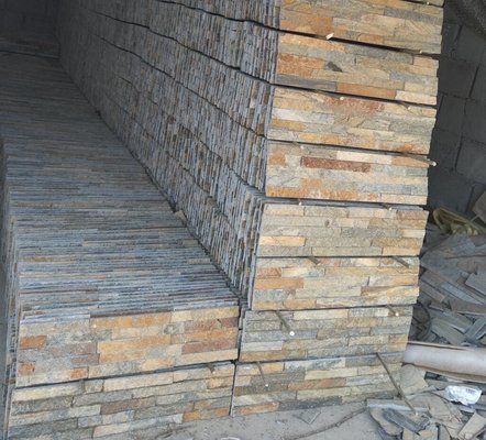 Rusty yellow beige grey slate cultured stone wall panels veneer cladding tiles stacked sotne ledge stone glued