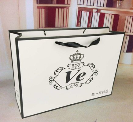 custom luxury black c1s art paper matt laminated shopping bag with ribbon bow,250 gsm art paper bag for clothes