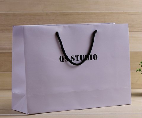 custom luxury black c1s art paper matt laminated shopping bag with ribbon bow,250 gsm art paper bag for clothes