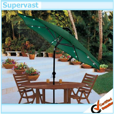 Tilted Green Garden Gleam Commercial Patio Umbrella With Solar Lights