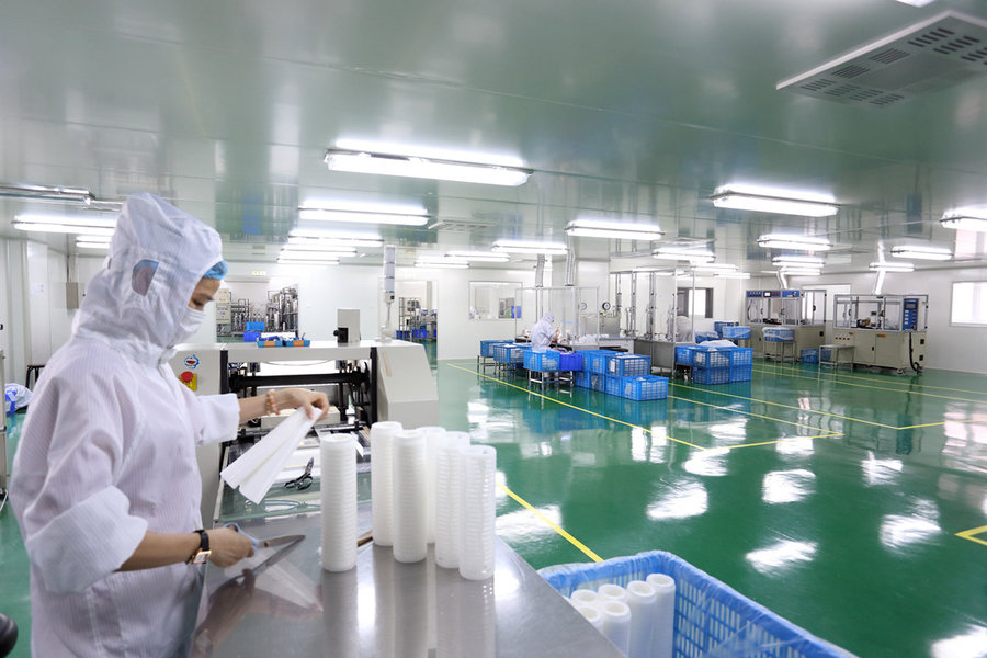 Hangzhou Tianshan Precision Filter Material Co., Ltd línea de producción del fabricante