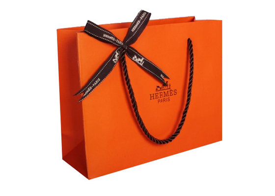 Elegant Orange Color Branded Paper Bag Logo Printed Cord Handle With Bow