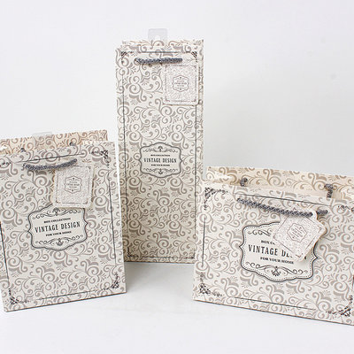 China Vintage design jewelry packaging paper bag own logo printing rope handle supplier