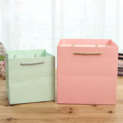 Colorful custom sliver stamping ivory paper bag with logo printing service candy packaging bag supplier