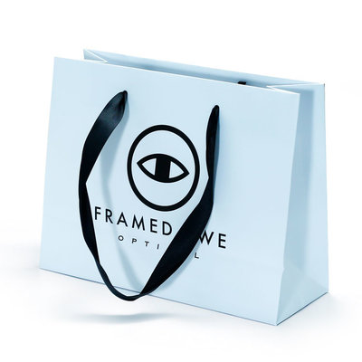 Durable high quality promotion gloss glasses packaging paper bag supplier
