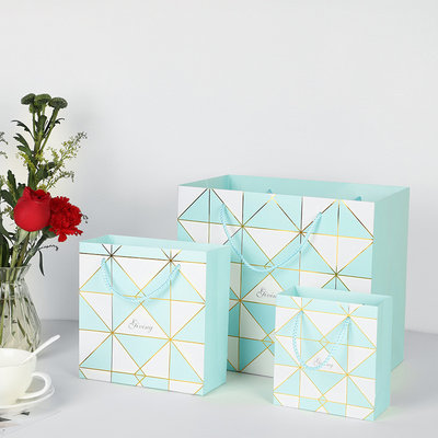 OEM men's business suit gift paper packaging white paper bag with handle supplier