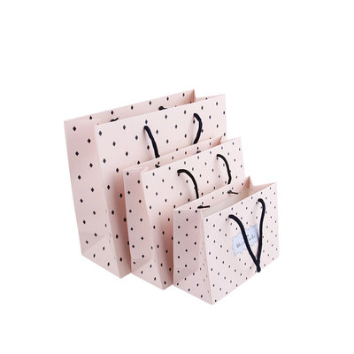 Cheap paper bag packaging wedding gift packaging with rope handle supplier
