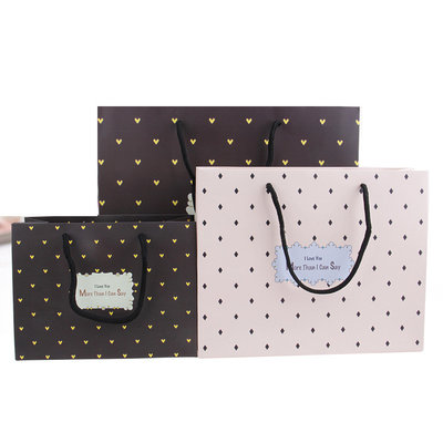 Cheap paper bag packaging wedding gift packaging with rope handle supplier