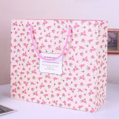 Cheap paper bag packaging wedding gift packaging with rope handle supplier