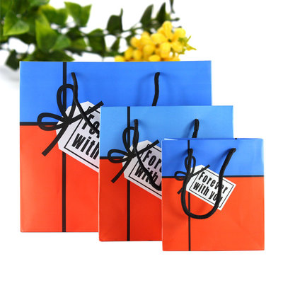 Custom printing logo advertising paper bag with false label supplier