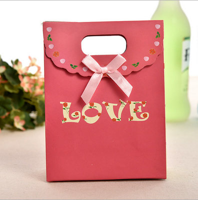 Wholesale high quality envelop shape gift bag with satin bow diecutting handle promotional gift paper bags