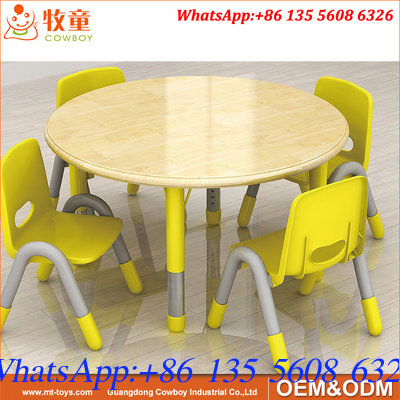 Day Care Centre High Quality 4 Seats Round Wood Table and Plastic Chairs for 2-5 years old kids supplier