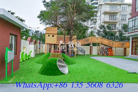 Kindergarten wooden tree house outdoor playground equipment with climbing net supplier