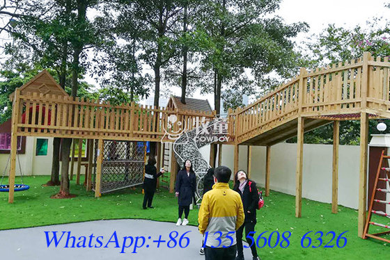 Kindergarten wooden tree house outdoor playground equipment with climbing net supplier