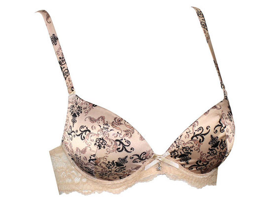 La jolie femme de sexe de mode capitonnée soulèvent le soutien-gorge floral de dentelle de satin de soutiens-gorge