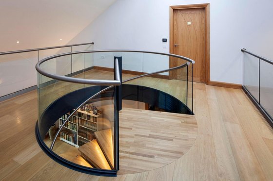 Stainless steel spiral staircase with wood steps and glass railing indoor glass spiral staircase