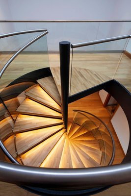 Stainless steel spiral staircase with wood steps and glass railing indoor glass spiral staircase