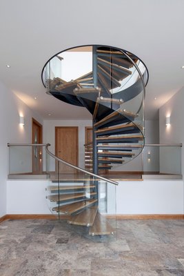 Stainless steel spiral staircase with wood steps and glass railing indoor glass spiral staircase
