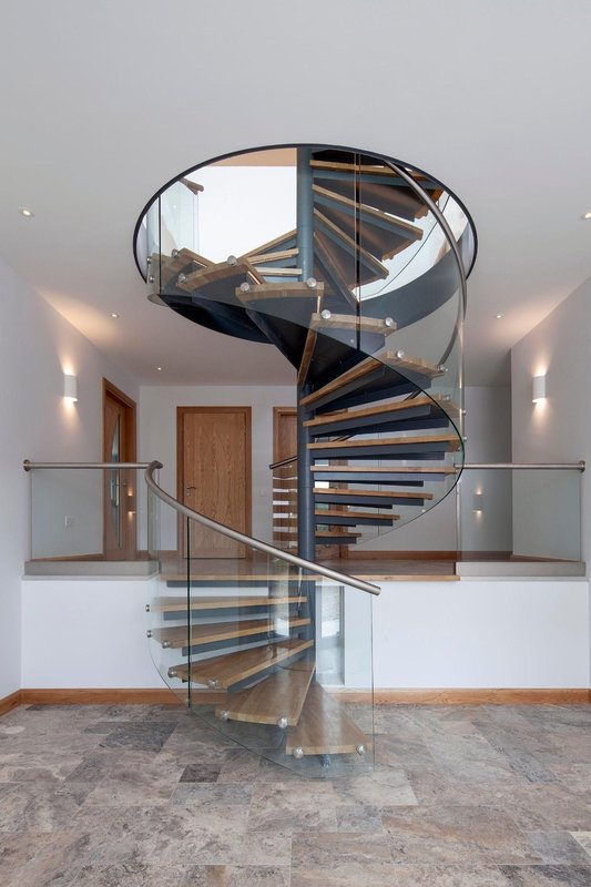 Stainless steel spiral staircase with wood steps and glass railing indoor glass spiral staircase