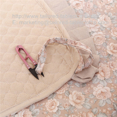 Cotton tablecloth with lace border and quilted chair cover with faux suede lining,