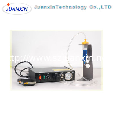 Glue dispensing machine, glue dispenser