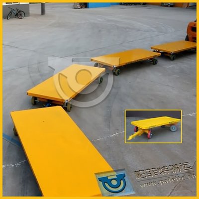 Tow tailer for assembly line with moving platform