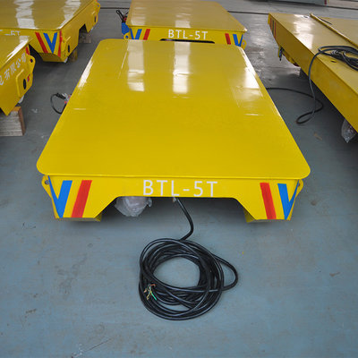 Smal tonnage trailing cable powered railway van running on the track for moving cargo in wearhouse