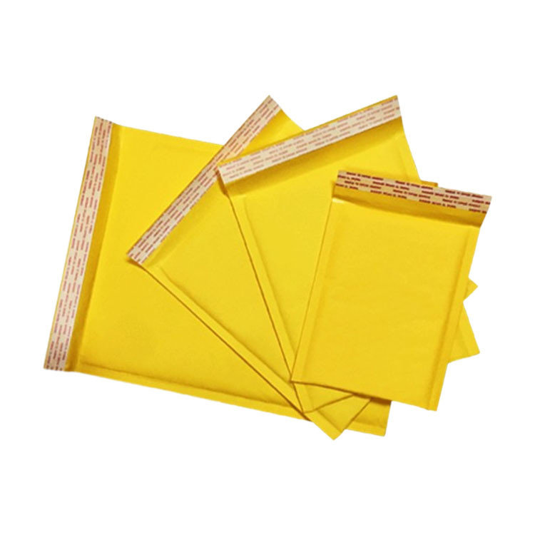 Yellow kraft paper envelope packaging bubble mailer foam shipping logistics courier bag