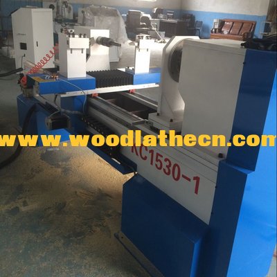 CNC controlled wood turning lathe designed for turning spindles, posts, columns and even baseball bats