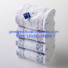 China 72*34cm Pure Cotton simple classic grid face towel embroidered hand towel with satin supplier